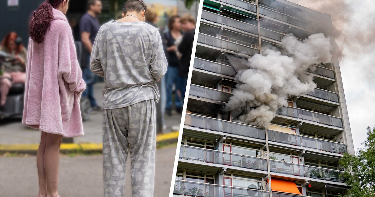 In badjas en pyjama op straat, boven hen slaan vlammen uit de flat: ‘Ik ...